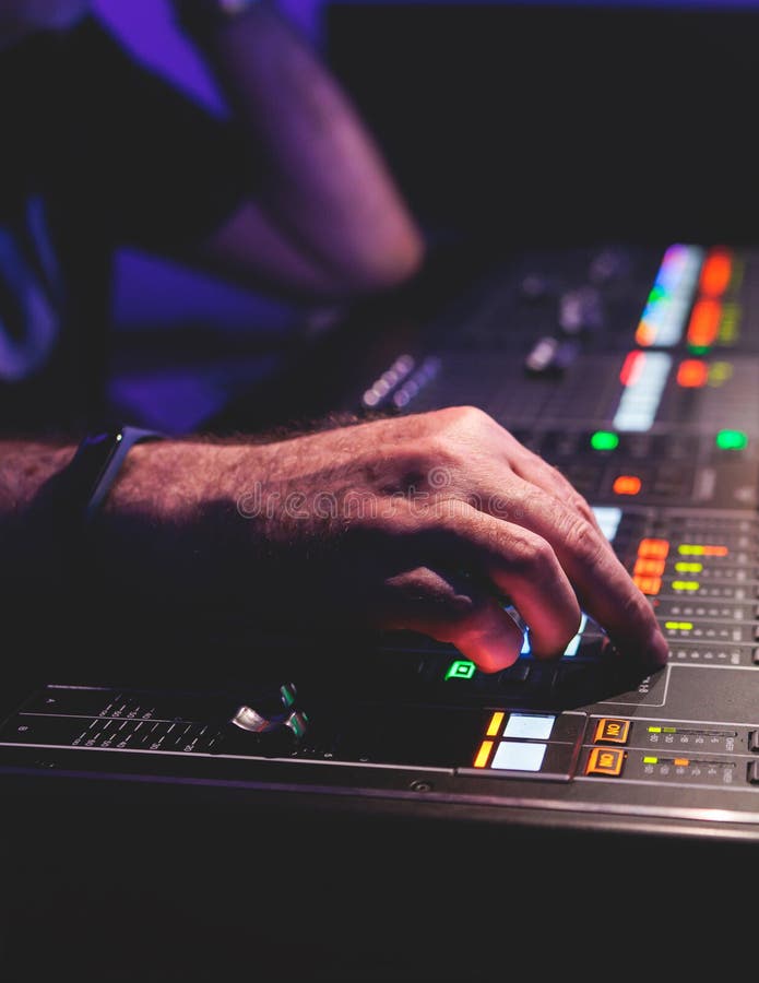 View of Lighting Engineer Operator Working on Mixing Console Workplace ...