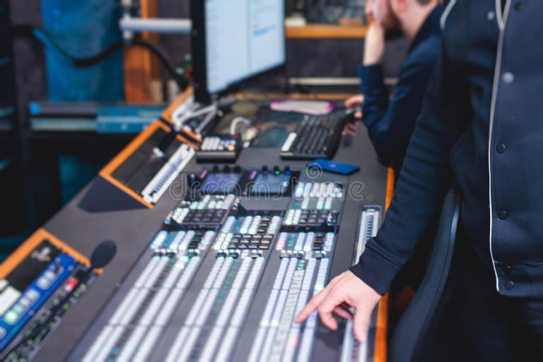 View of Lighting Technician Operator Working on Mixing Console ...