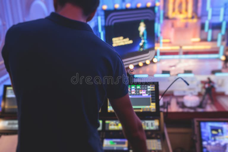 View of Lighting Technician Operator Working on Mixing Console ...