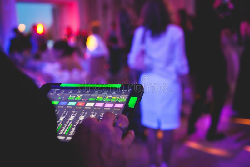 View of Lighting Technician with Tablet, Operator Controlling Sound and ...