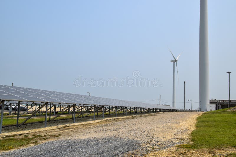 View of a Long Array of Solar Panels with an Electric Generating Wind ...