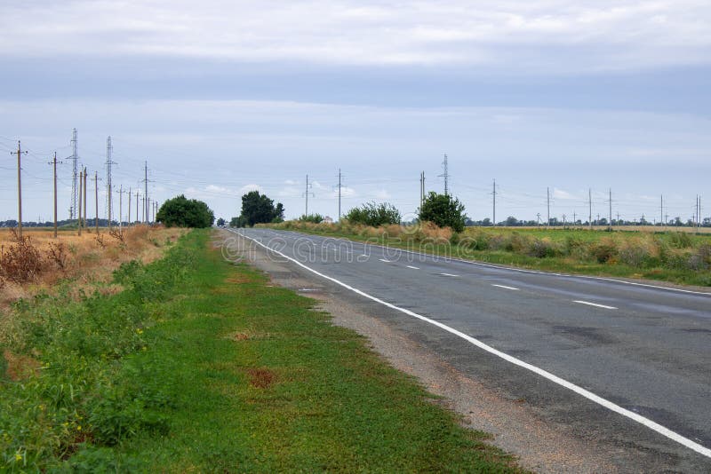 View on the Long Roadside Which Green Grass. Stock Photo - Image of ...