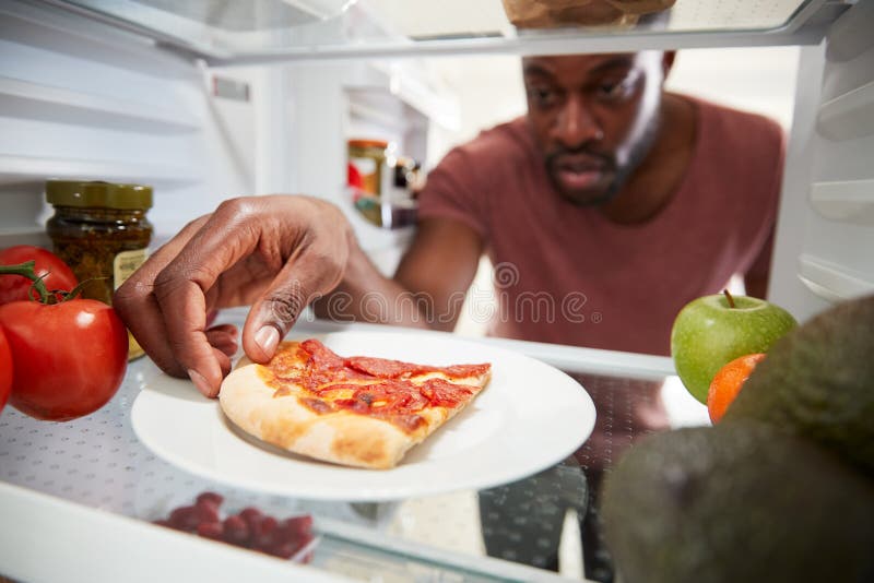 View Looking Out from Inside of Refrigerator As Man Opens Door for ...