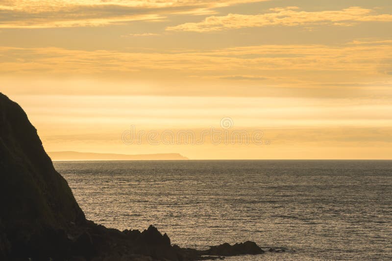 View of Lundy Island from the Beach Across the Ocean Stock Photo ...