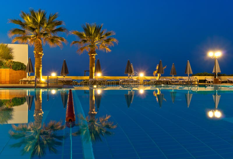 Swimming pool at sunset stock image. Image of swimm, asia - 105355