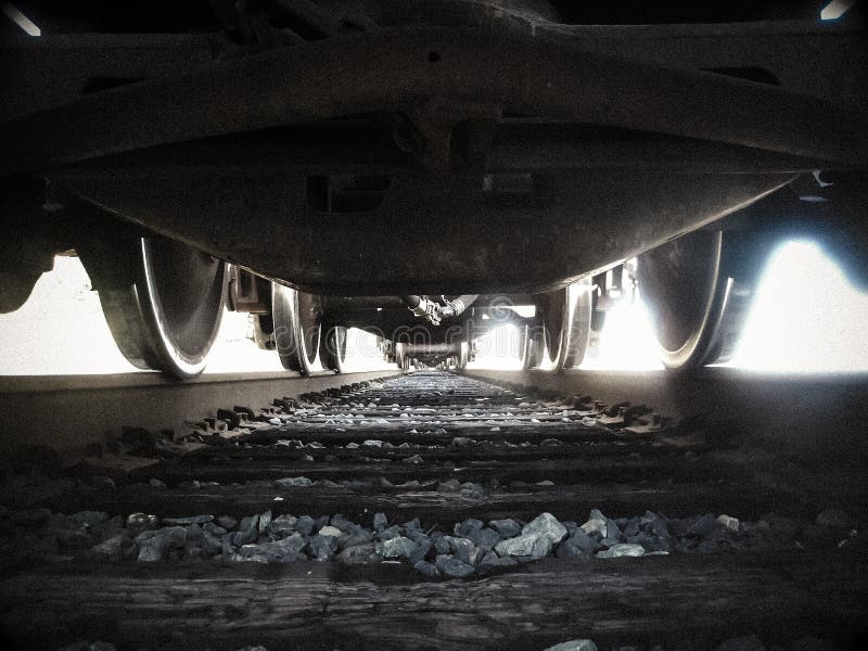 View Lying Underneath a Train Stock Image - Image of railroad, railcar ...