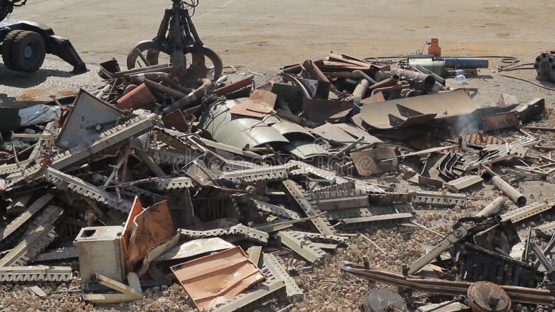 Loader Manipulator with Hydraulic Grappling Claw is Loading Scrap Metal ...