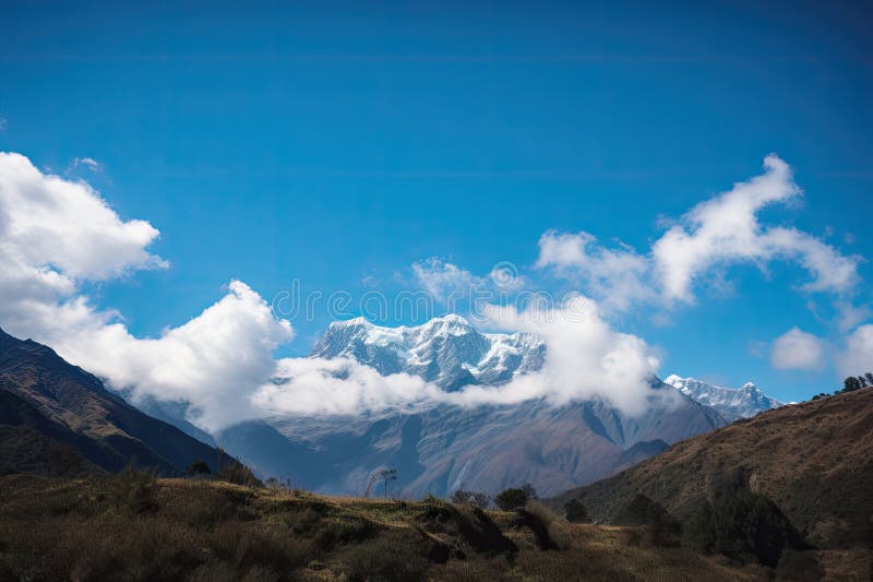 View of Majestic Mountain Range, with Clear Blue Skies and Fluffy ...