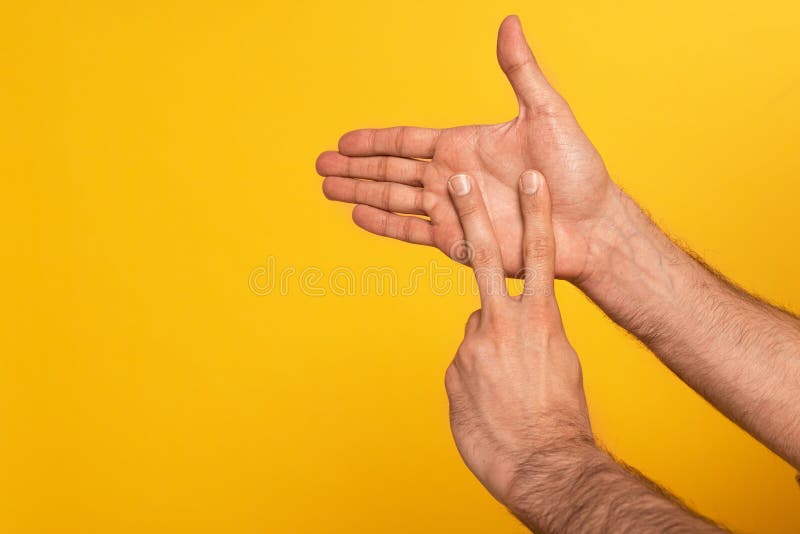 View Of Man Showing Gesture In Deaf And Dumb Language Isolated On Yellow Stock Image Image Of