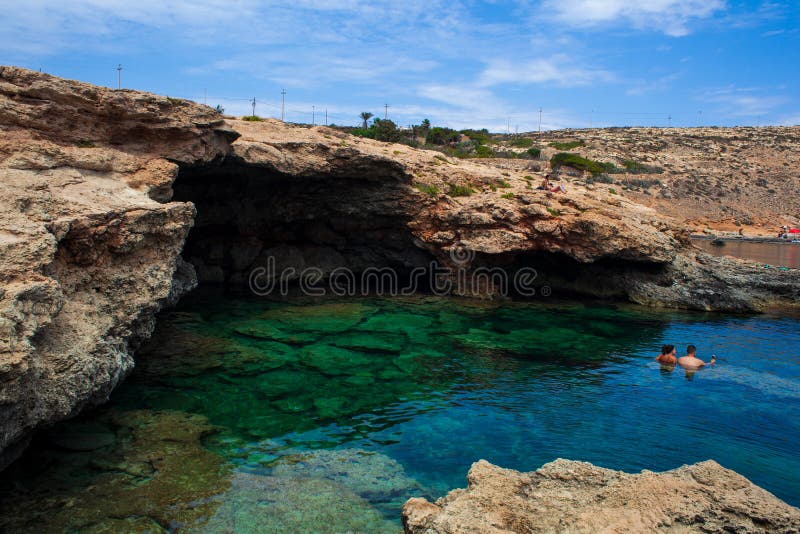 View of Mare Morto beach editorial photography. Image of tanning ...