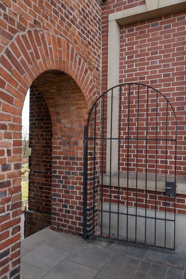 View of the Masonry Arch Brick with Metal Door Stock Image - Image of ...