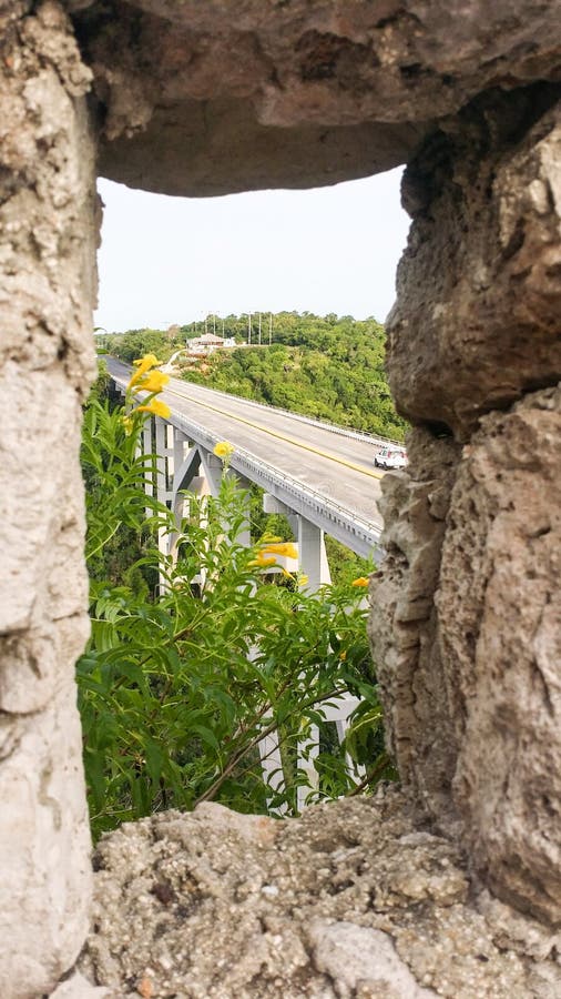 View on Matanzas Bridge through Window in Stone Wall Stock Photo ...