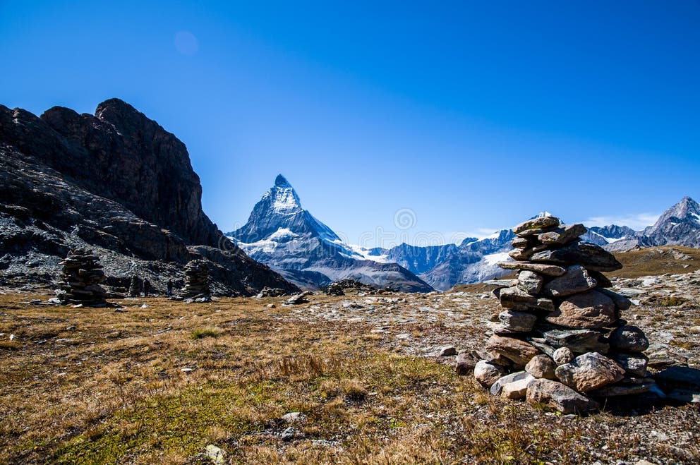 View of Matterhorn and Piles of Stones Stock Photo - Image of blue ...