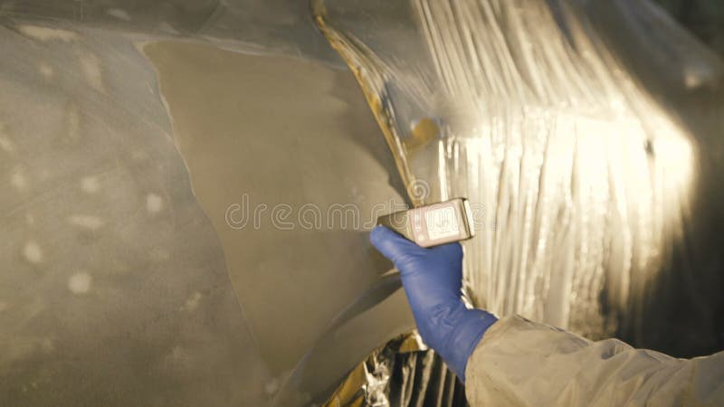 View of Measuring a Thickness of Primer on a Car Surface Using a ...