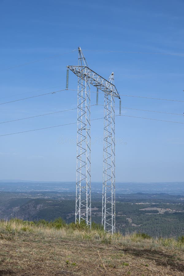 View of a Metallic High Voltage Pylon on a Blue Sky Day Stock Photo ...