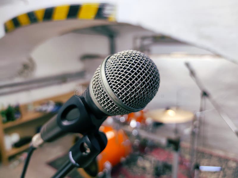 View of a Microphone in an Experienced, Silver Microphone in a Stand ...