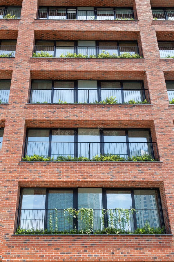 View On A Modern Brick Apartment Building Facade With Panoramic Windows ...