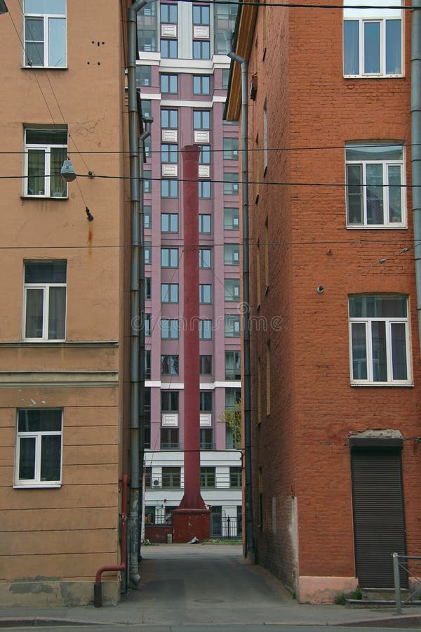 View of a Modern Building in the Passage between the Old Houses Stock ...