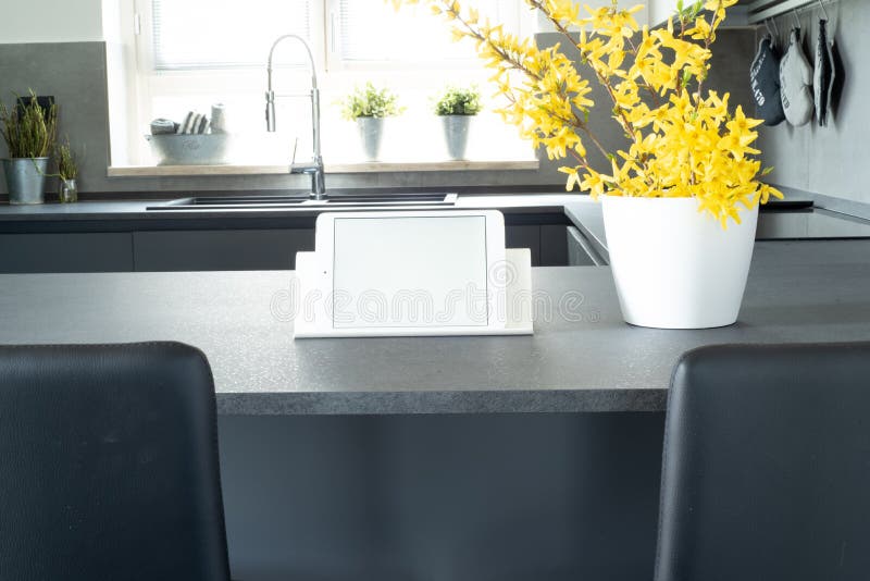 View of the Modern Kitchen. Mockup of a Tablet with White Blank Screen ...
