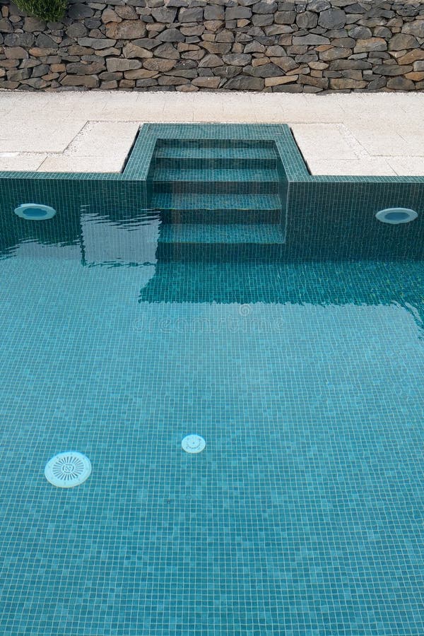View of the Modern Outdoor Swimming Pool with Clear Water. Rest in the ...