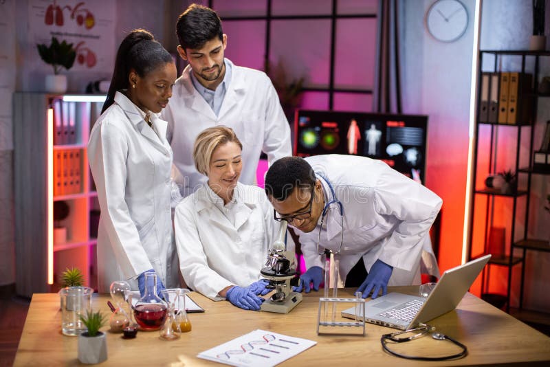 View of Modern University Research Laboratory with Multiracial Team of ...