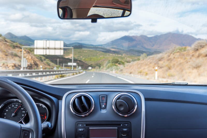 View of the Motorway and a Landscape of Mountains from Inside a Car ...