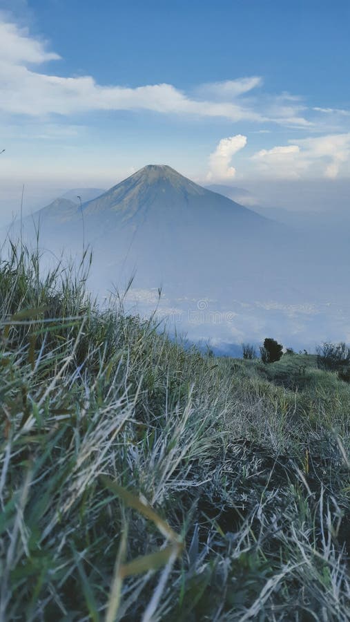 View of Mount Sindoro from Mount Sumbing Stock Photo - Image of plain ...