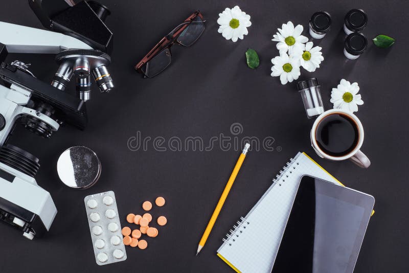 View from the Mountain Microscope with Tablets and Notebook on a Black ...