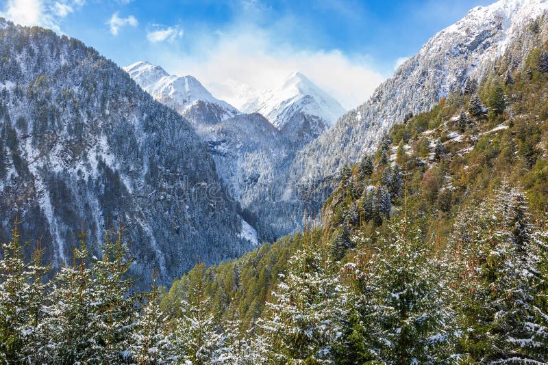 View at Mountain Ravine with Snow Capped Mountain Peaks Stock Image ...
