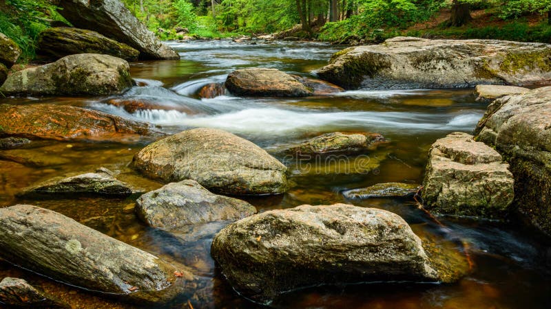 View of the Mountain Riverbed with Large Rocks and a Rapid River Stock ...