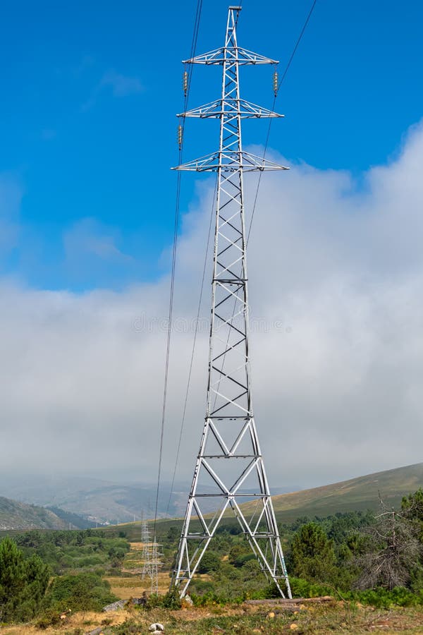 View at the Mountains with High Voltage Electric Posts, Metallic ...