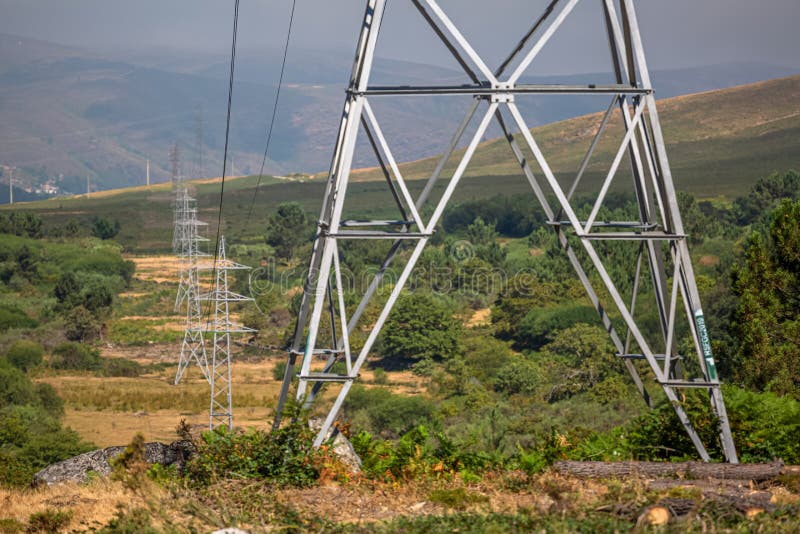 View at the Mountains with High Voltage Electric Posts, Metallic ...