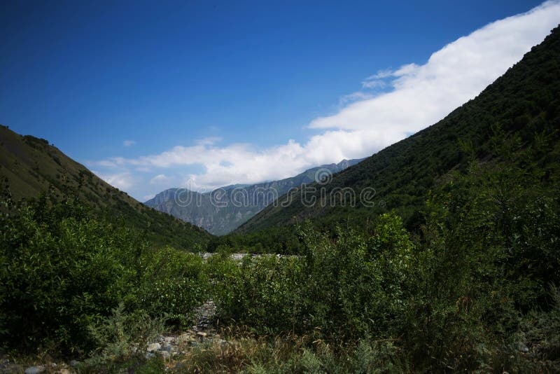 View of the Mountains of the North Caucasus. Mountains in the Clouds in ...