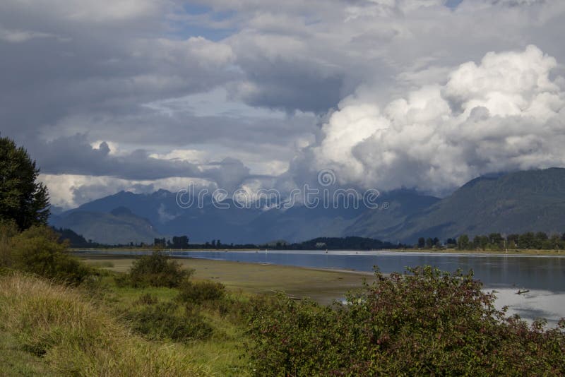 A View of the Mountains on the Other Side of a River Stock Photo ...