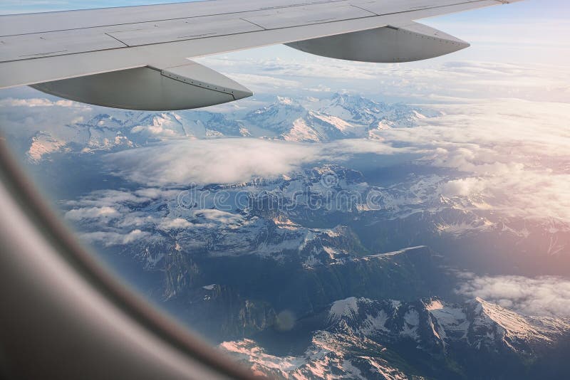 View of the Mountains in Snow and Clouds from within, Out of the Plane ...