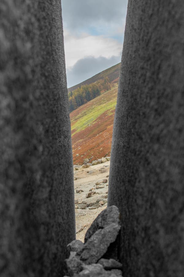 View of Mountains through a Split Boulder Stock Photo - Image of scenic ...