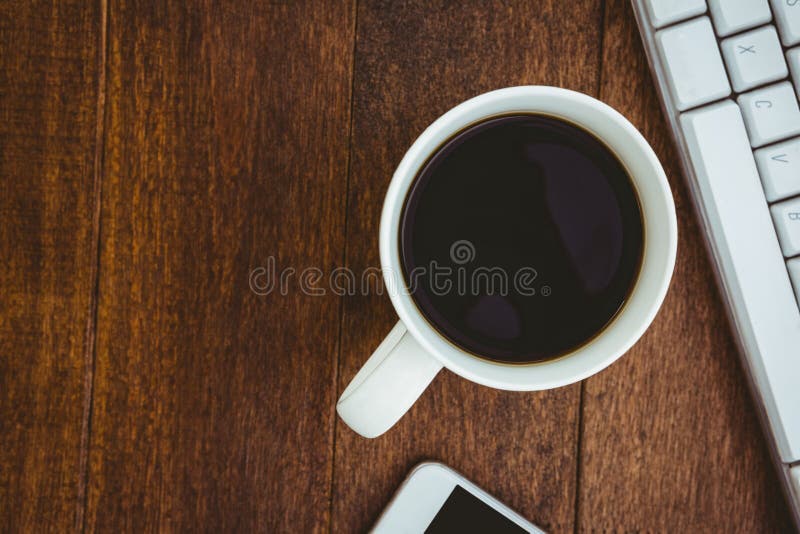 Cup of Coffee, Keyboard and Desktop Computer on Desk in White Home ...