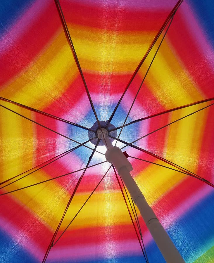View on a Multi Colored Umbrella in the Sun Stock Photo - Image of ...