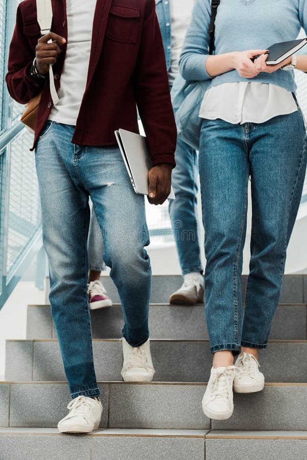 View of Multicultural Students with Notebook and Laptop on Stairs Stock ...