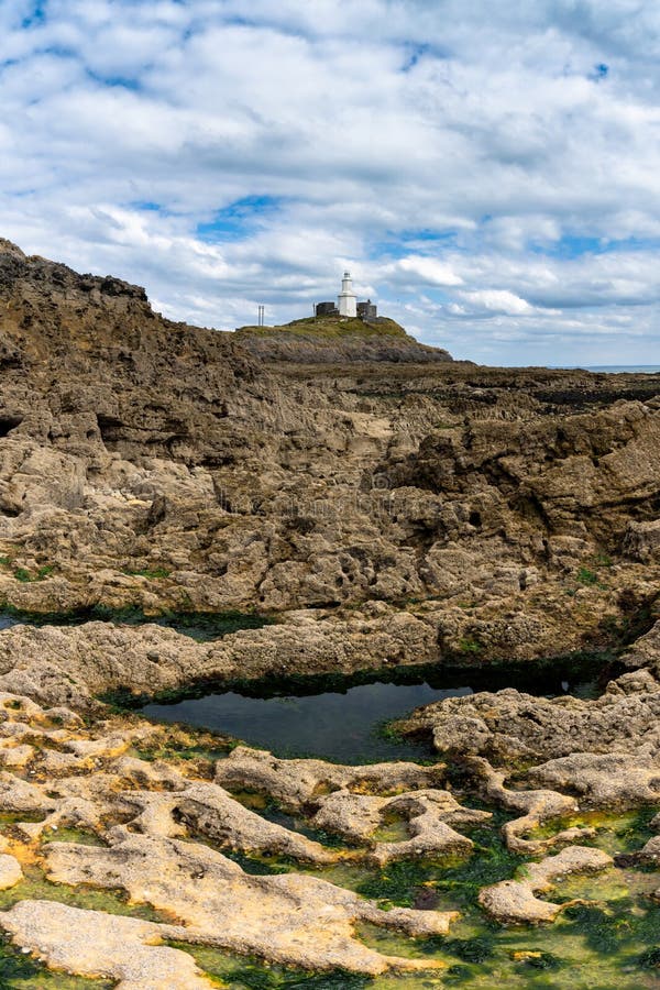 View of the Mumbles Lighthouse in Swansea Bay at Low Tide Stock Photo ...