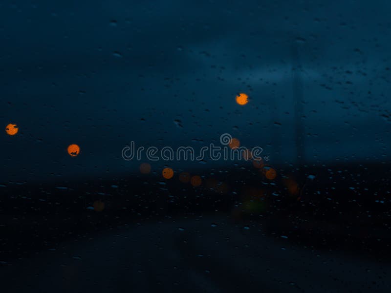 View of Night Highway through the Windshield of a Car at Speed in Rainy ...