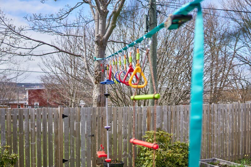 View of the Ninja Rope before the Fence in the Backyard on a Sunny Day ...