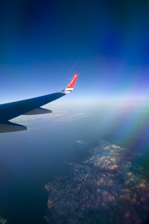 View from Norwegian Airplane Window with Blue Sky and White Clouds. 08. ...