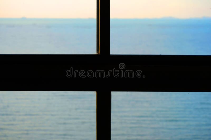 View of the Ocean from Inside a Window with Sunset Stock Image - Image ...