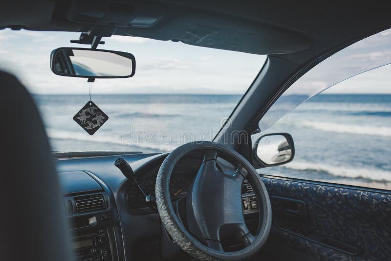 View of the Ocean with Large Waves from the Dark Interior of the Car ...