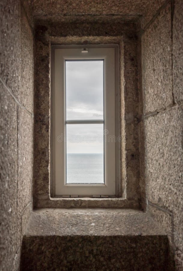 View of the Ocean through a Lighthouse Window in the Stone Staircase ...