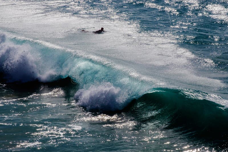 View on the Ocean and an Little Figure of a Surfer in the Waves Stock ...