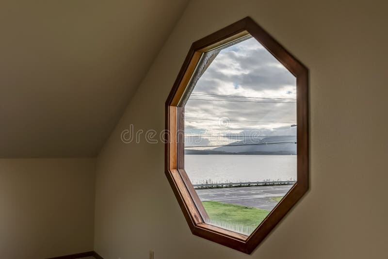 View of the Ocean through an Octagon Window Stock Image - Image of ...