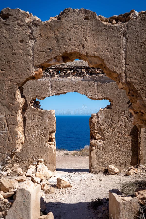 View of the Ocean through the Ruins of an Old Stone Building on a Sunny ...