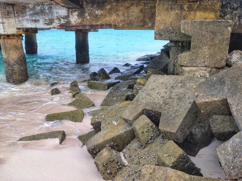 A View of the Ocean through the Support Beams of a Pier. the Ocean is a ...